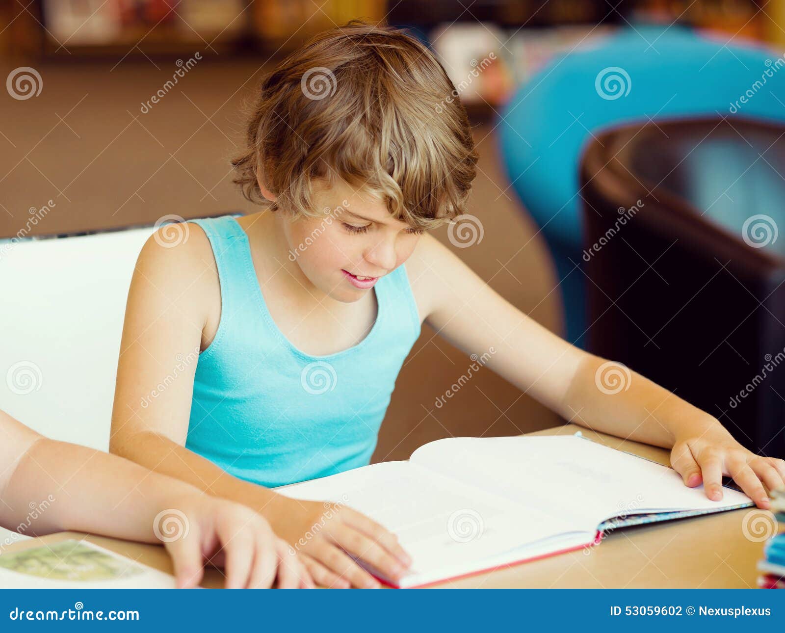 Boy in library stock photo. Image of white, education - 53059602