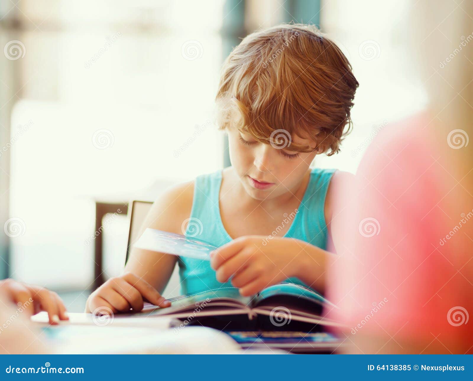 Boy in library stock image. Image of studying, elementary - 64138385