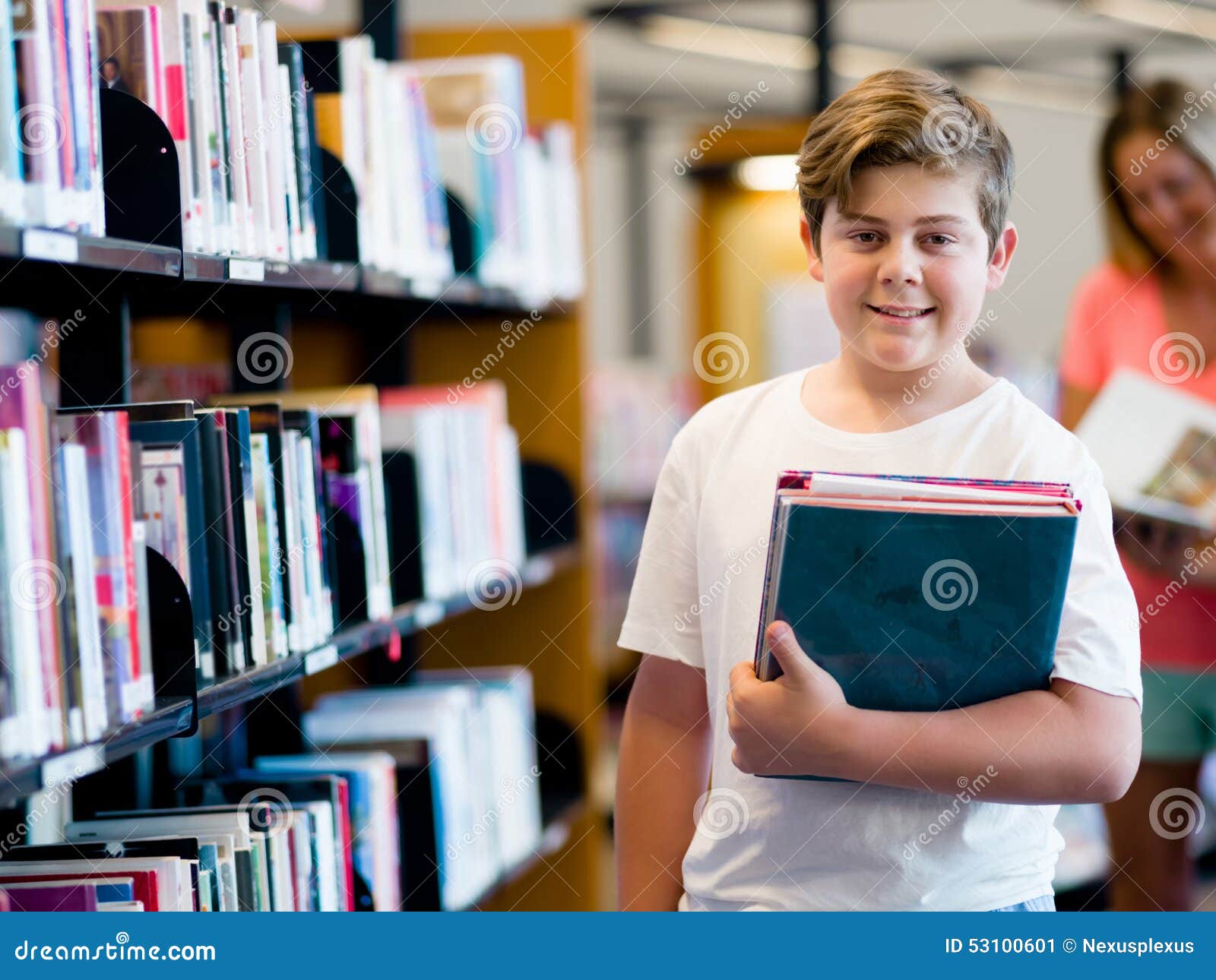 Boy in library stock image. Image of people, books, pick - 53100601