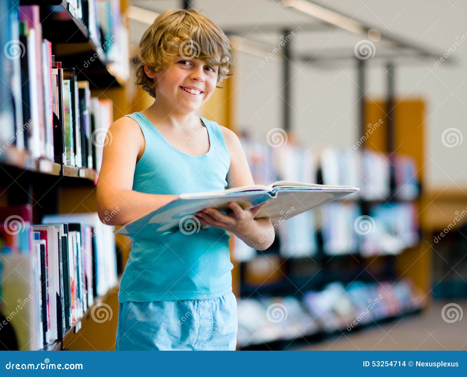 Boy in library stock photo. Image of elementary, knowledge - 53254714