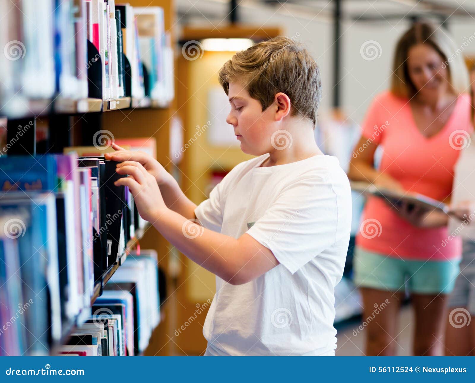 Boy in library stock photo. Image of preschooler, school - 56112524