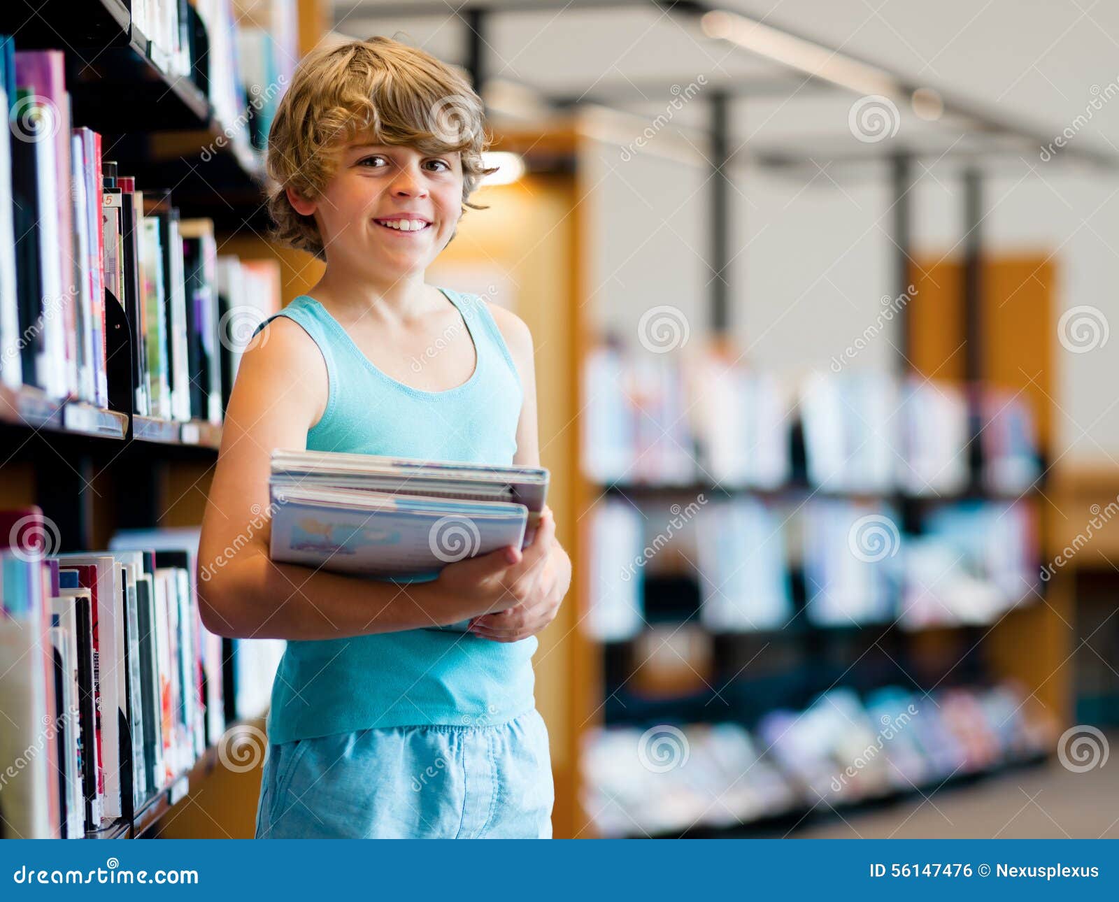 Boy in library stock photo. Image of project, select - 56147476