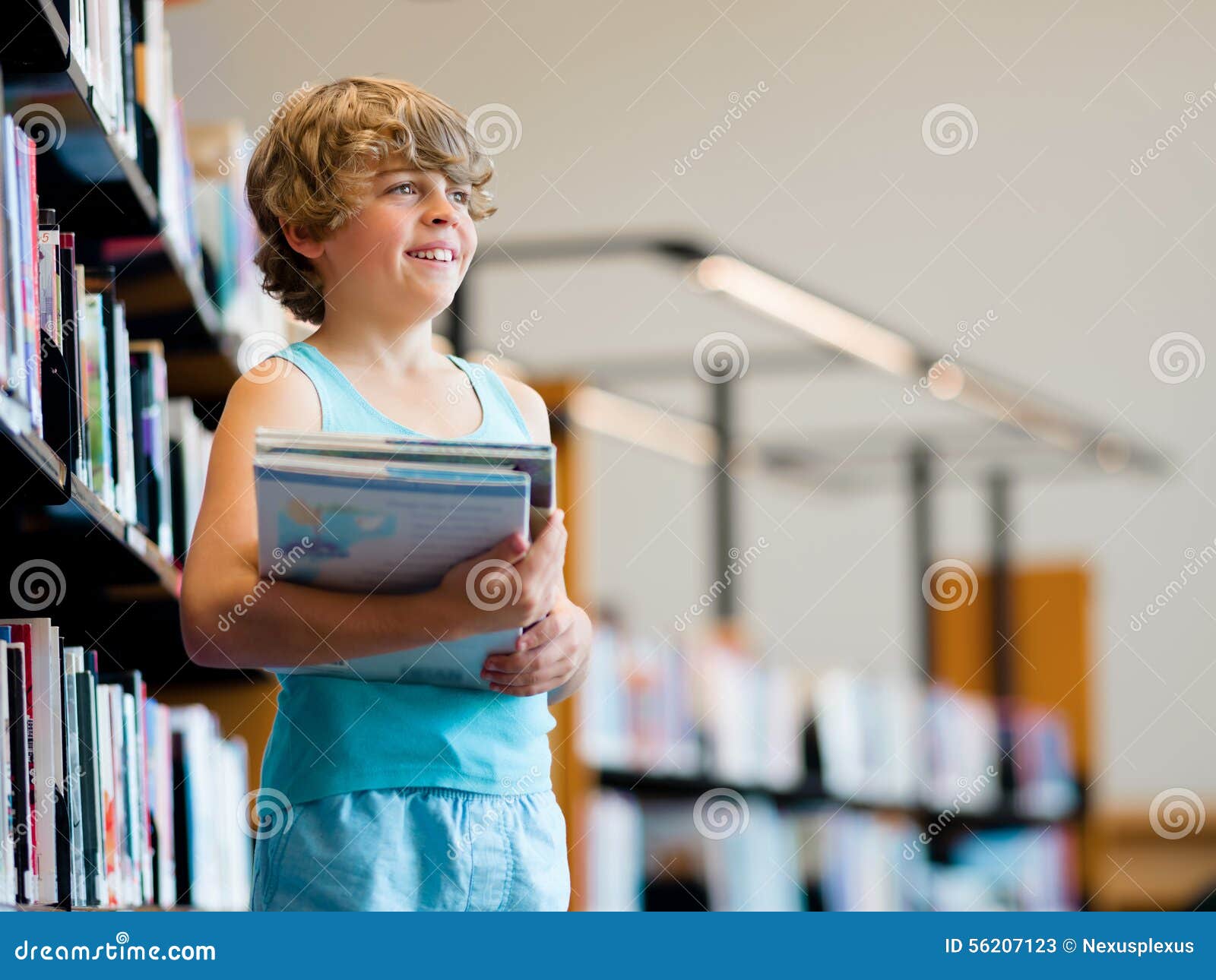 Boy in library stock image. Image of read, library, male - 56207123