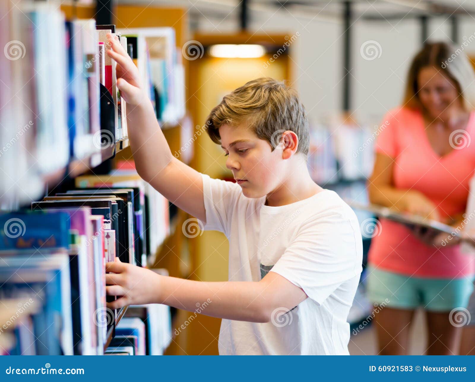 Boy in library stock image. Image of bookshelf, portrait - 60921583