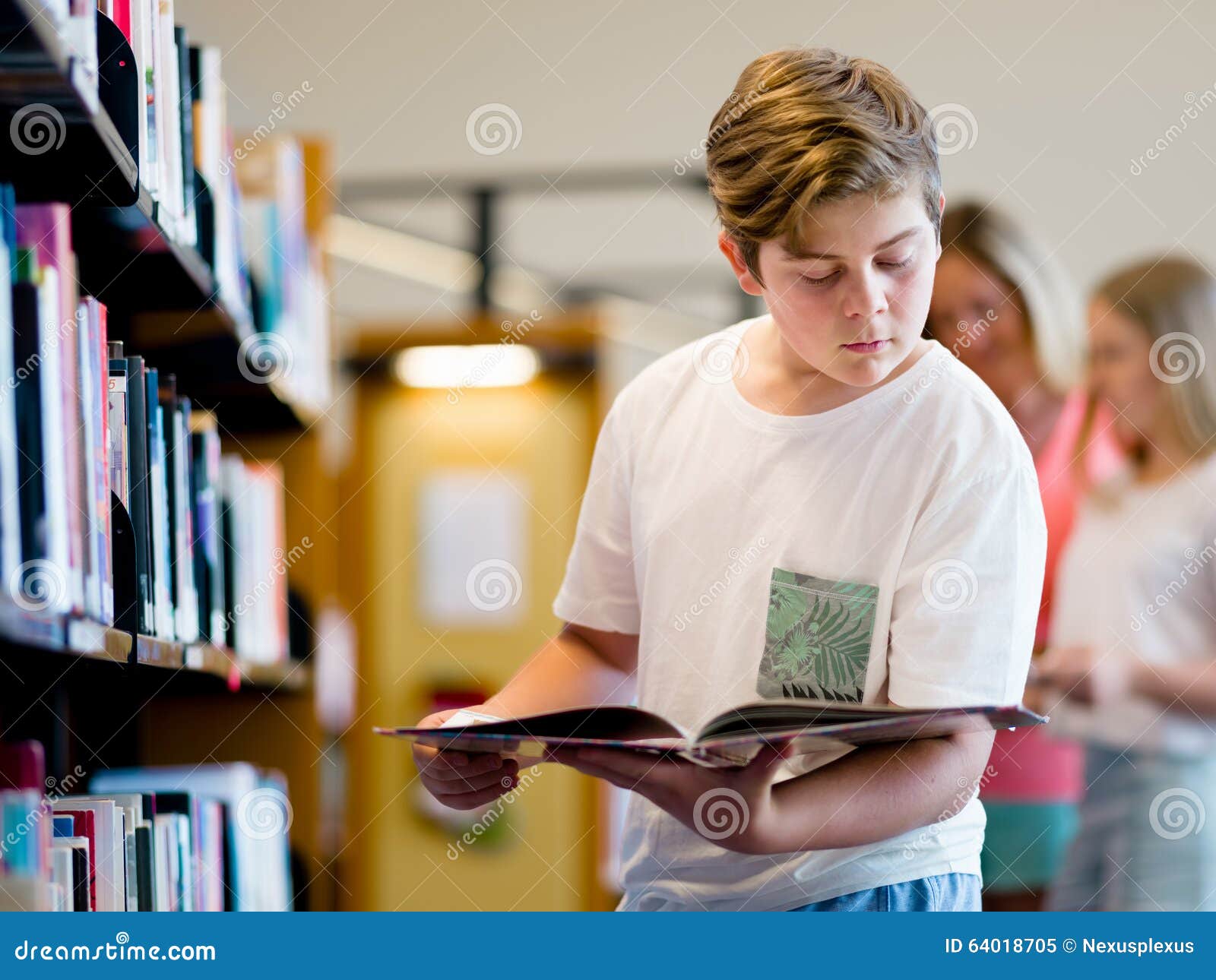 Boy in library stock image. Image of library, learn, elementary - 64018705