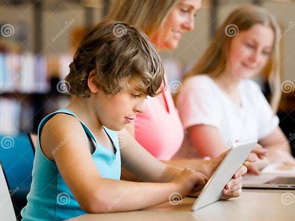 Boy in Library with Computer Stock Photo - Image of daughter, homework ...
