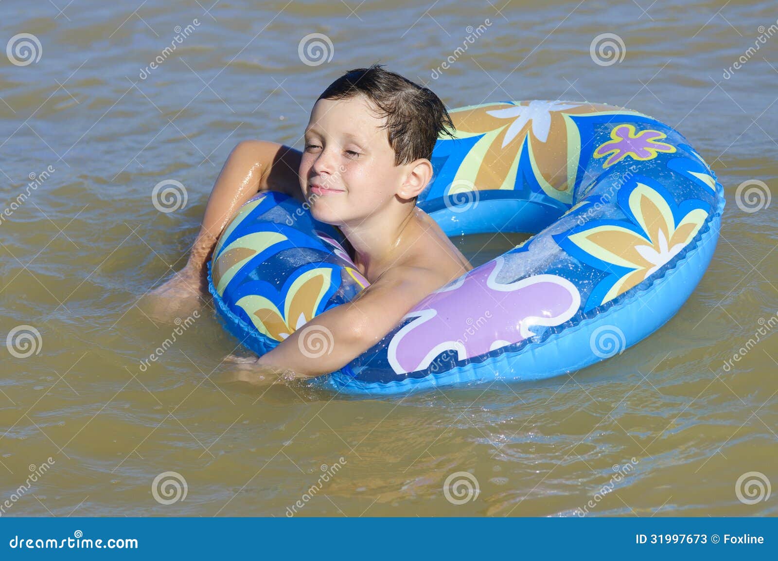 Boy in a Life Buoy in the Sea Stock Image - Image of children ...