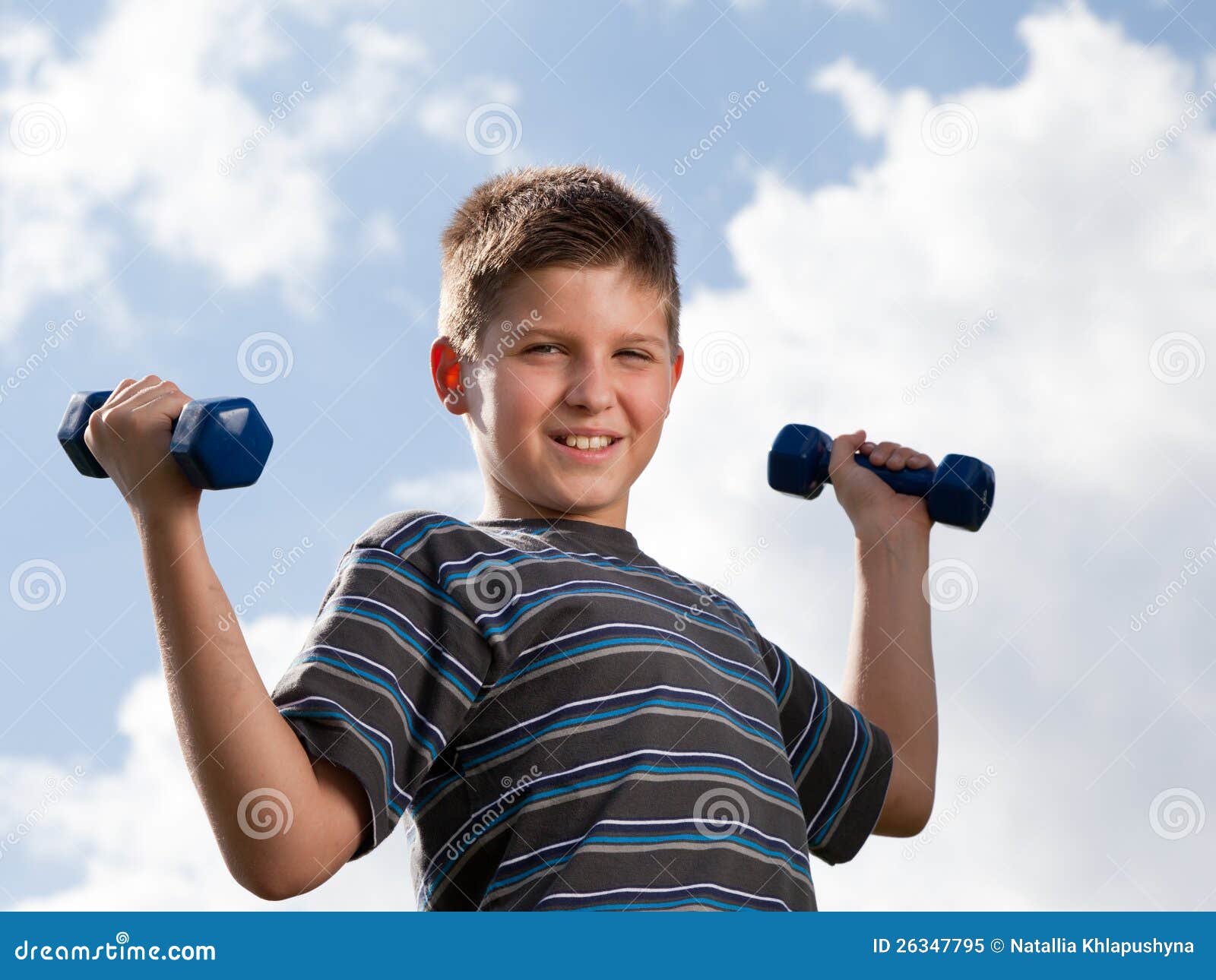Boy Lifting Dumbbells Outdoors Stock Image - Image of muscular, bicep ...