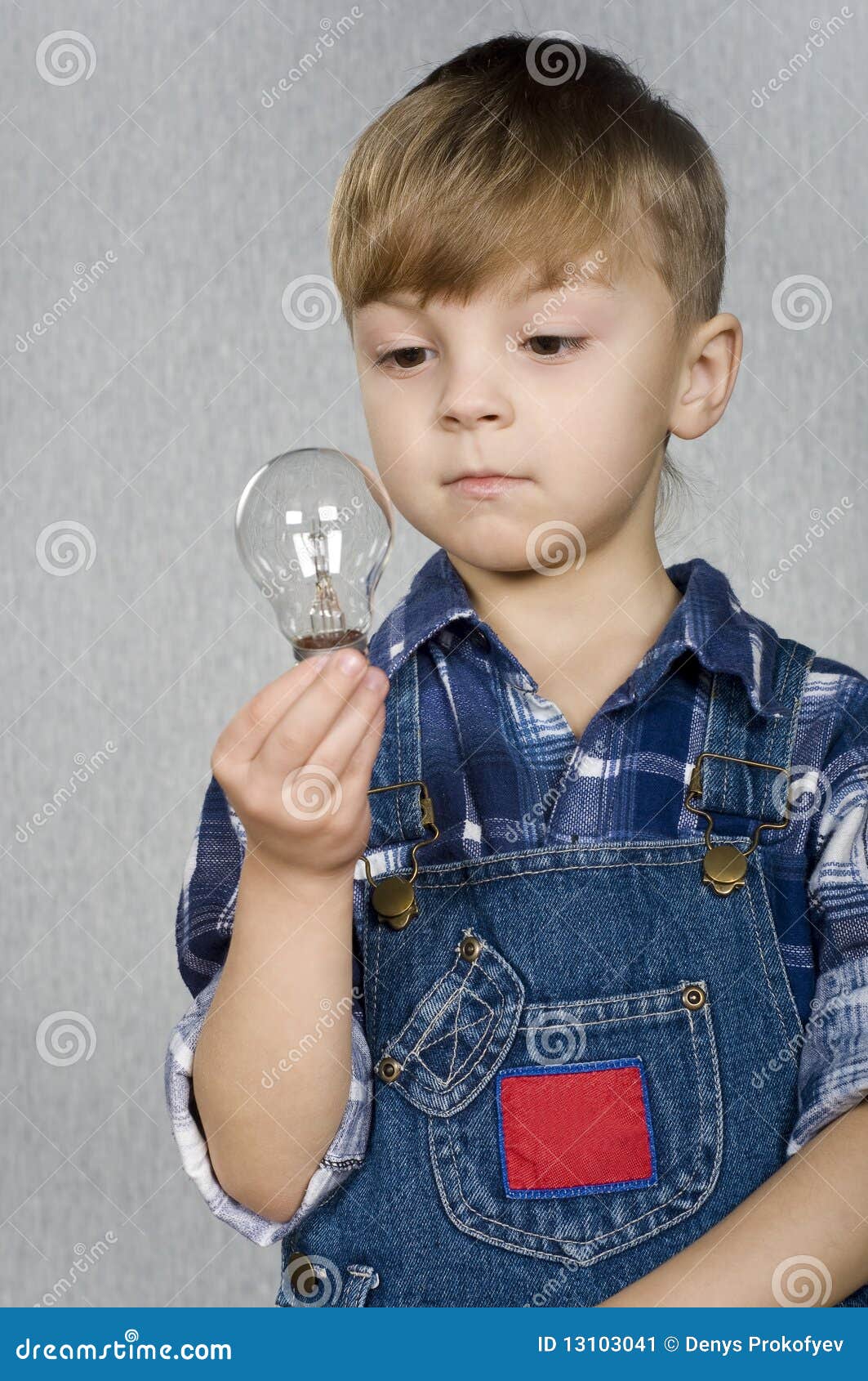 Boy and light bulb stock image. Image of power, looking - 13103041