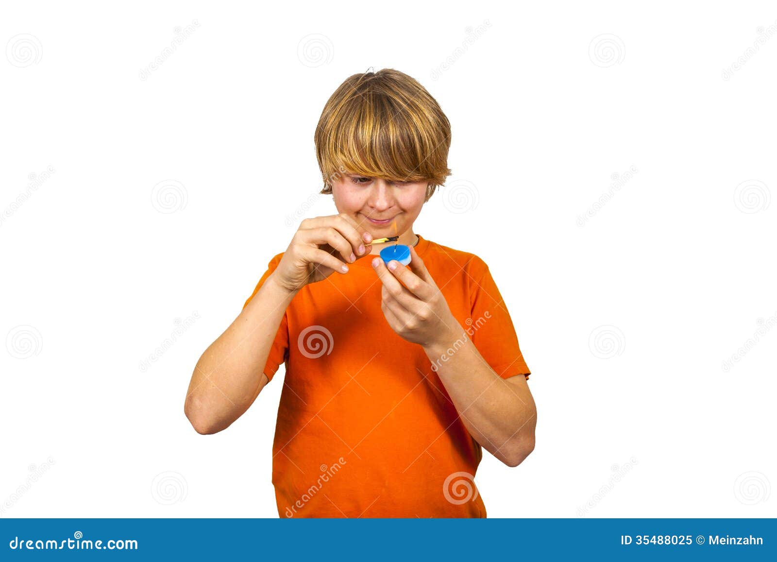 Boy lights a candle stock image. Image of candlestick - 35488025