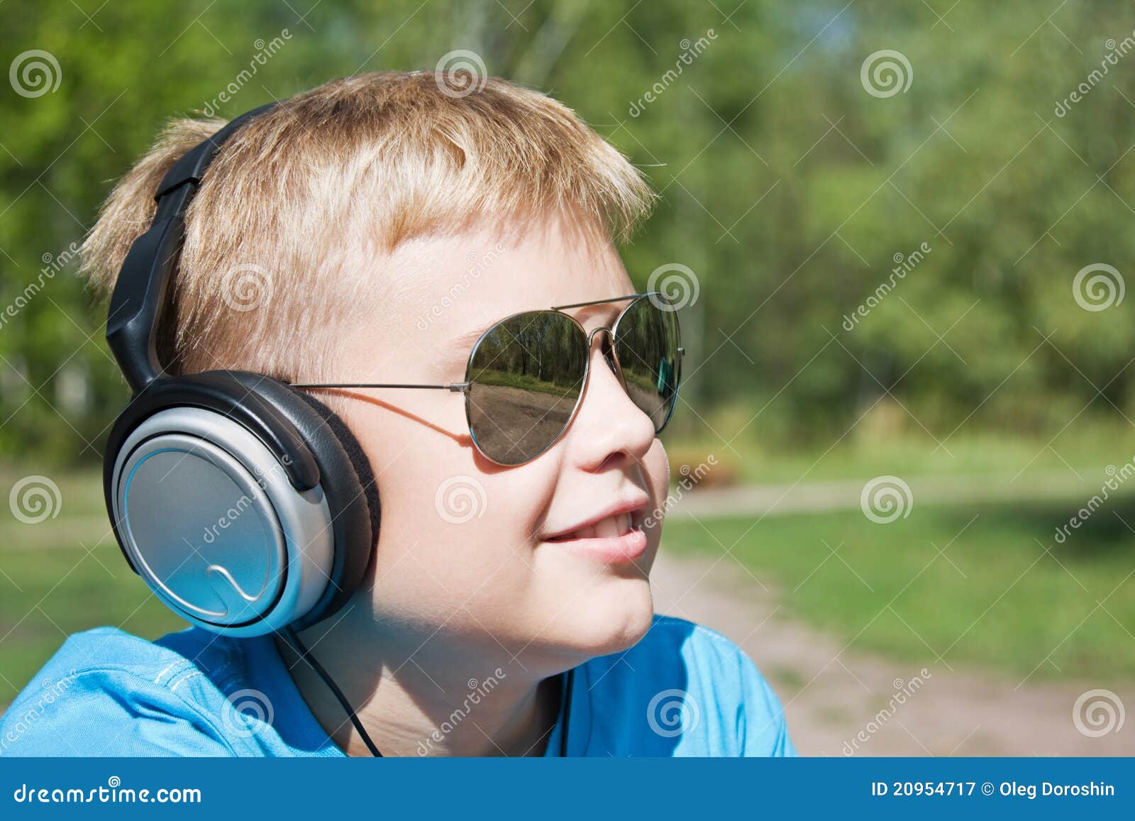 Boy listening to music stock image. Image of innocence - 20954717