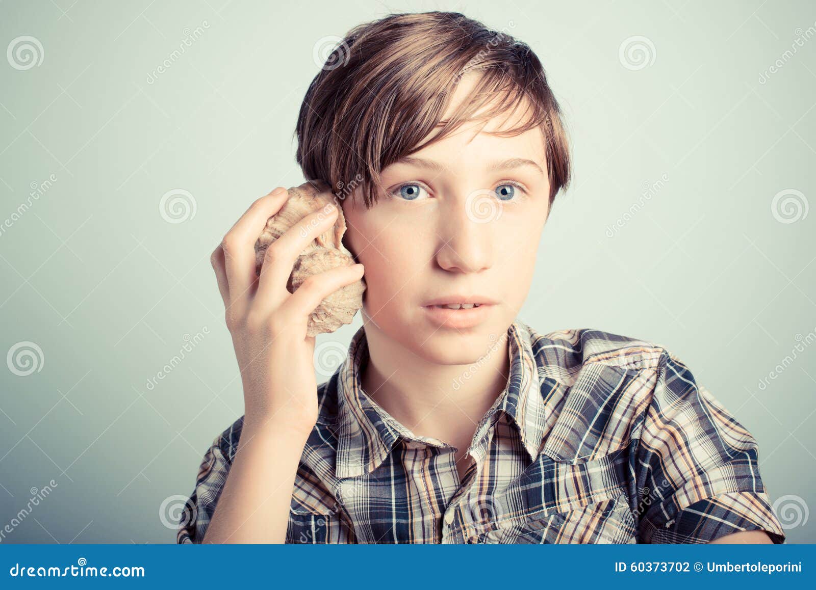 Boy Listening To the Sound of the Sea Stock Photo - Image of curiosity ...