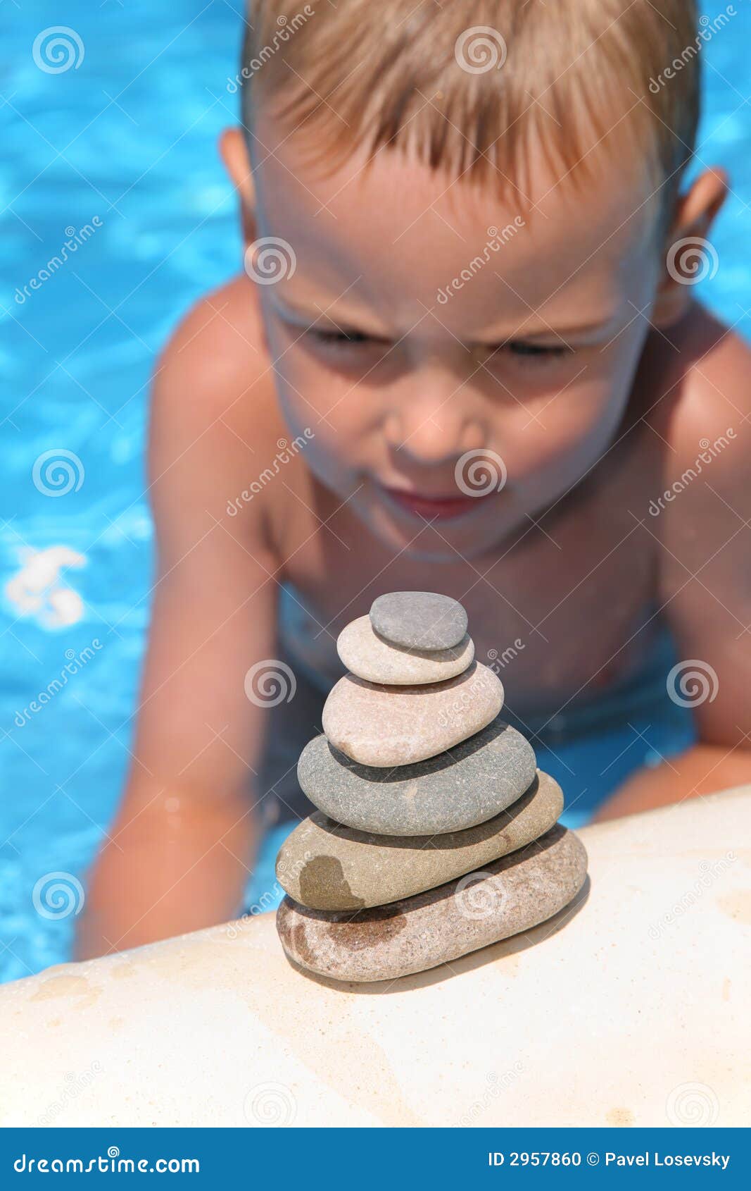 Boy with little stones stock photo. Image of outdoors - 2957860