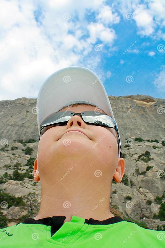 The boy is looking afar stock image. Image of teenager - 18753767