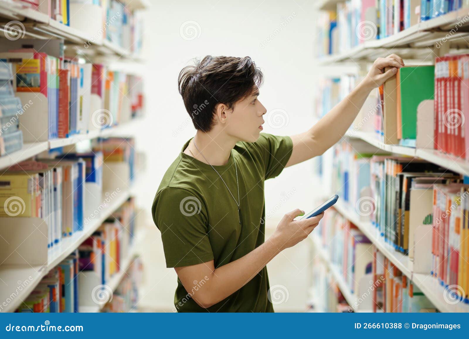 Boy Looking for Book in Library Stock Photo - Image of research ...