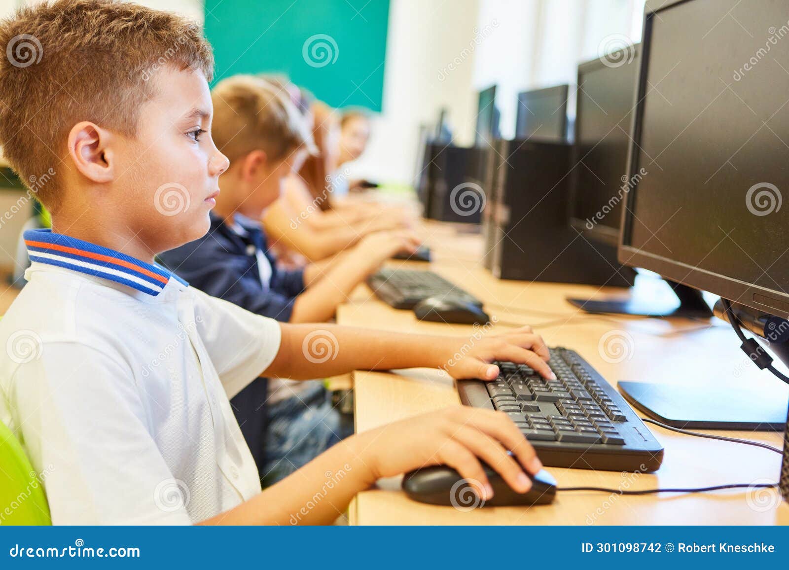 Boy Looking at Computer Screen Sitting at Desk Stock Photo - Image of ...