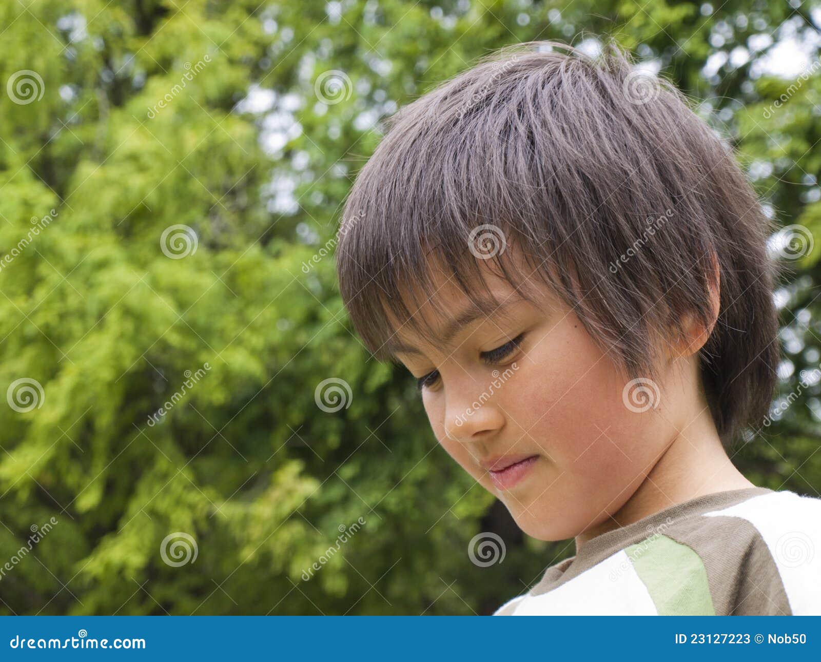 Boy looking down stock image. Image of outdoors, asian - 23127223