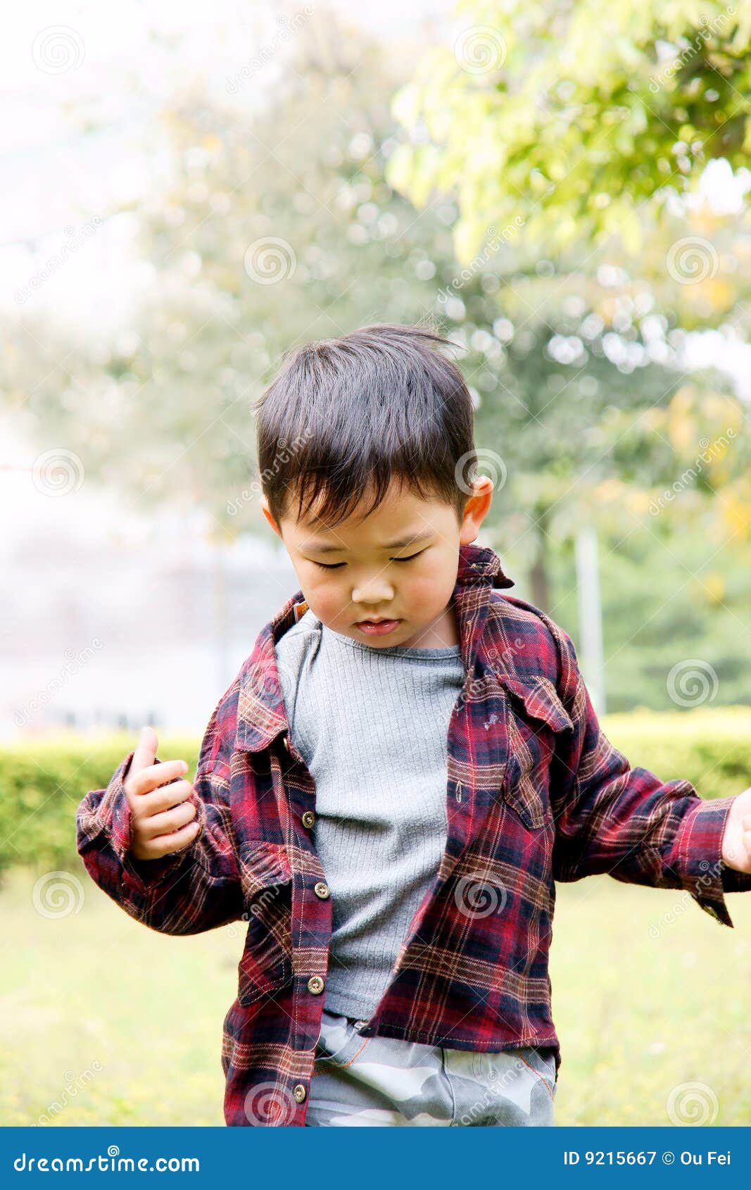 Boy looking down stock image. Image of chinese, standing - 9215667