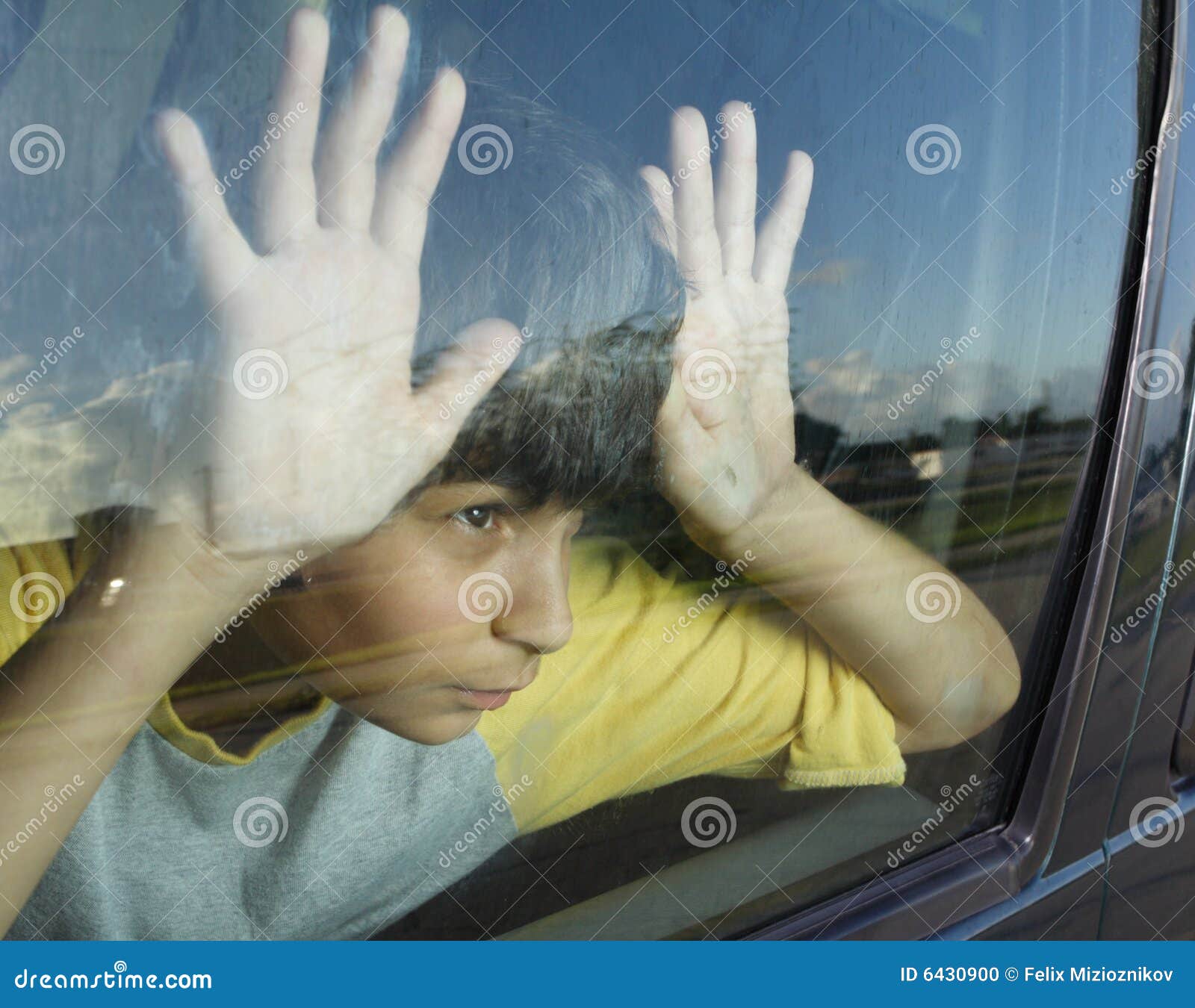 Boy looking through glass stock photo. Image of clear - 6430900
