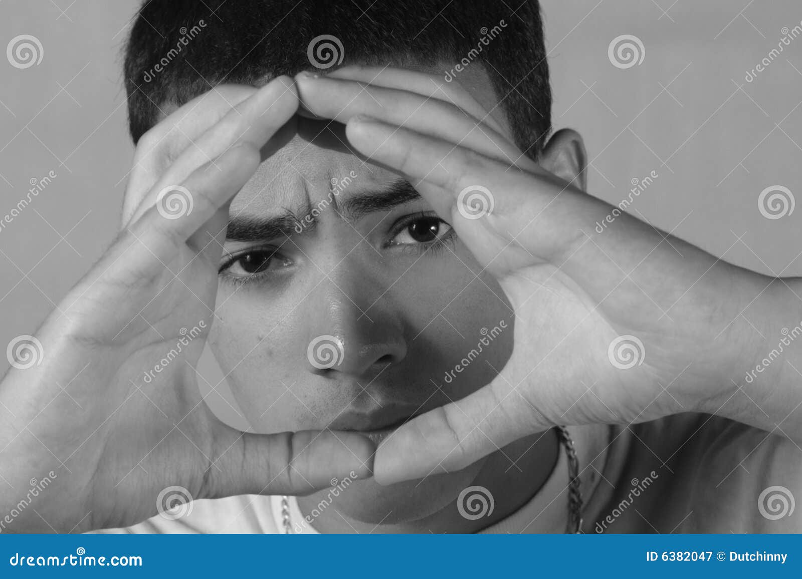 Boy looking through hands stock image. Image of hand, round - 6382047