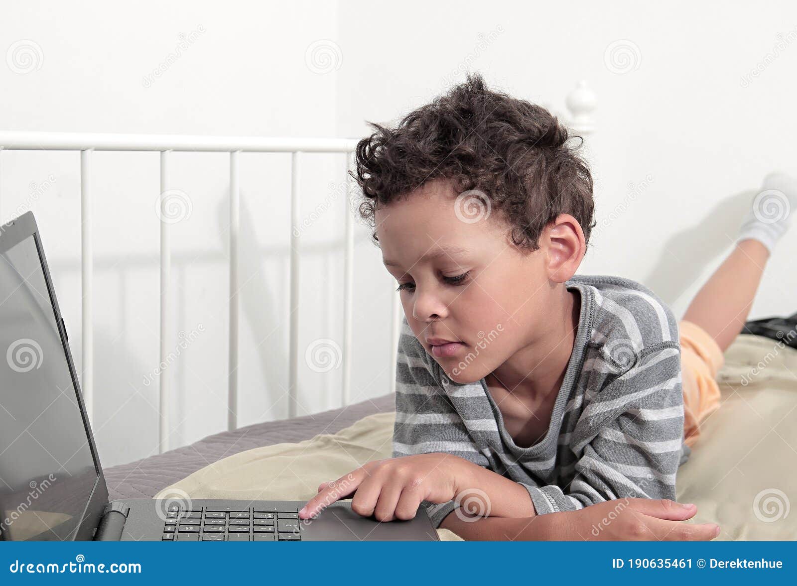 Boy Looking at a Laptop Screen Stock Photo Stock Image - Image of ...