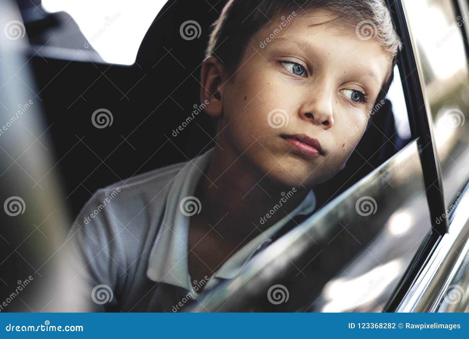 Boy Looking Out the Car Window Stock Photo - Image of thinking ...