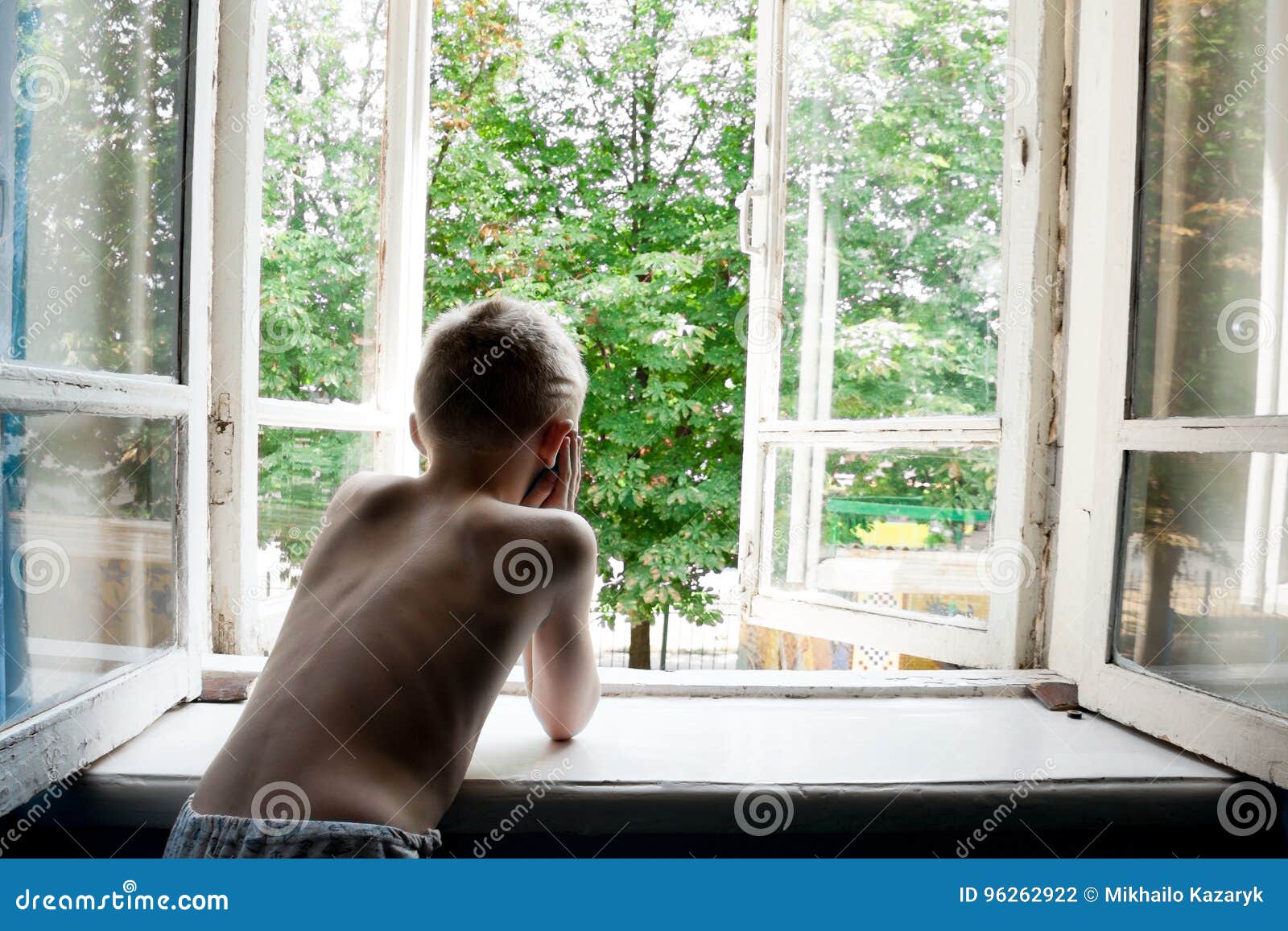 The Boy is Looking Out the Window Stock Photo - Image of poverty ...