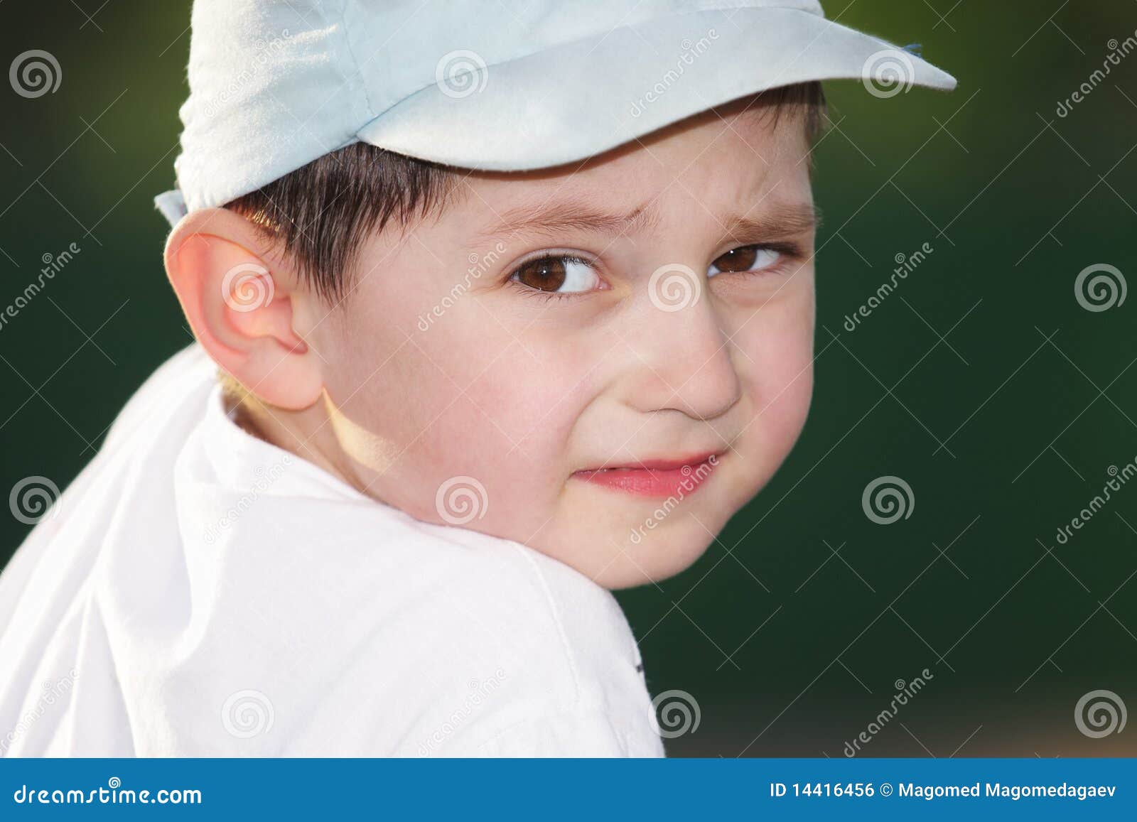 Boy looking over shoulder stock photo. Image of brunette - 14416456
