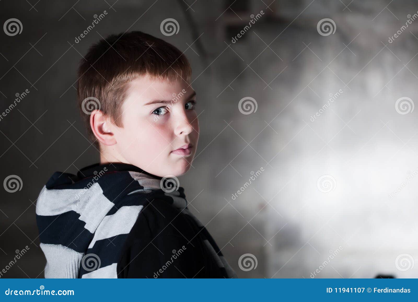 Boy Looking Over the Shoulder Against Grunge Backg Stock Image - Image ...