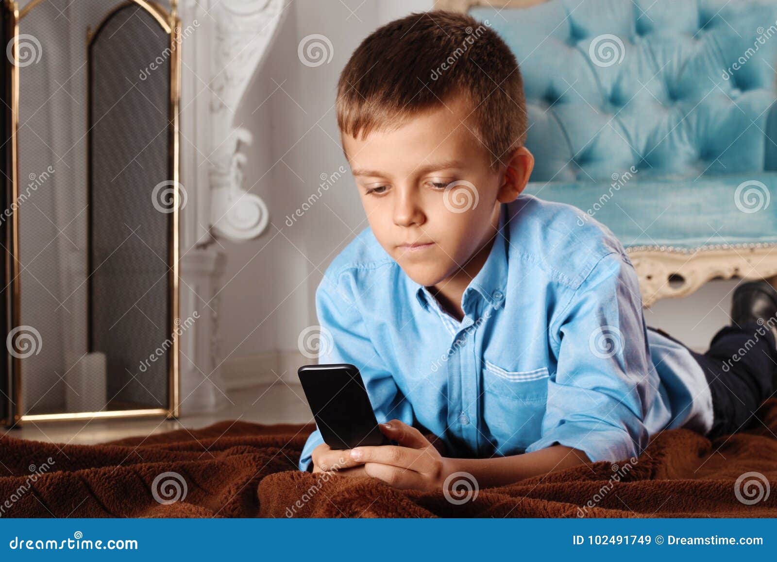 The Boy is Looking at the Phone Stock Image - Image of shocked, phone ...