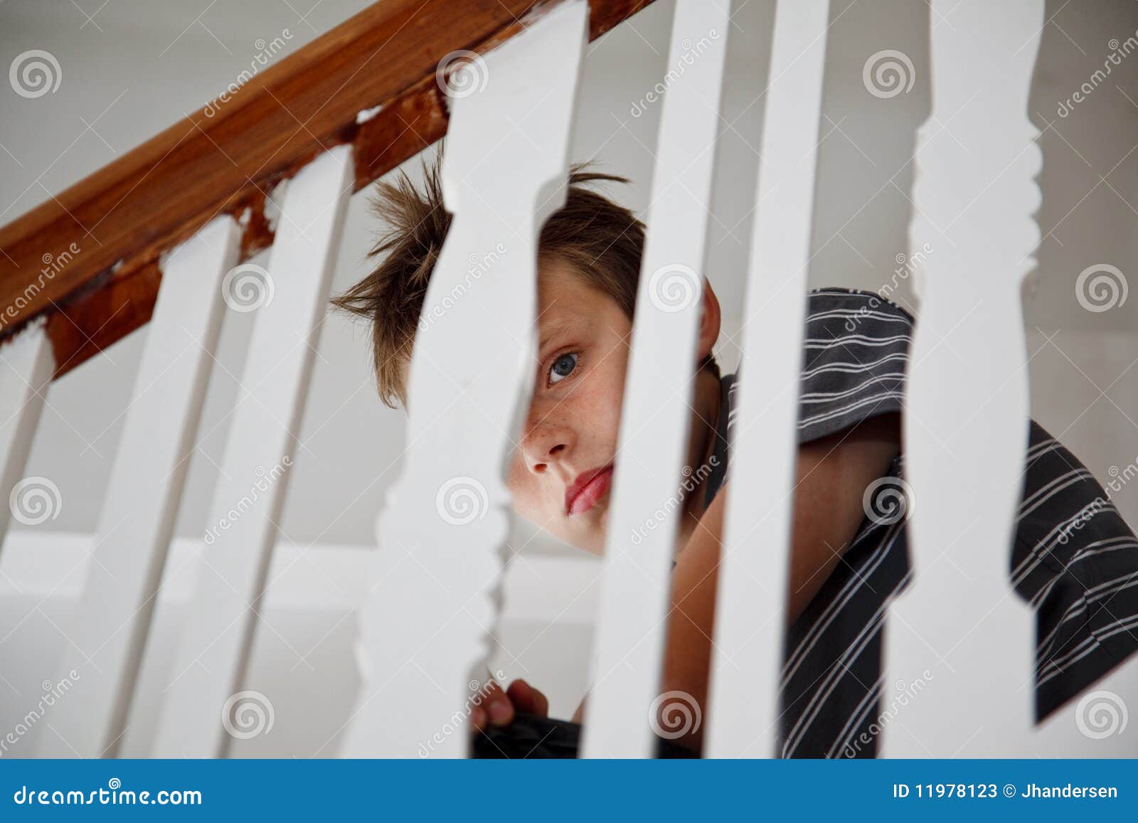Boy Looking Scared through the Handrail Stock Image - Image of lonely ...
