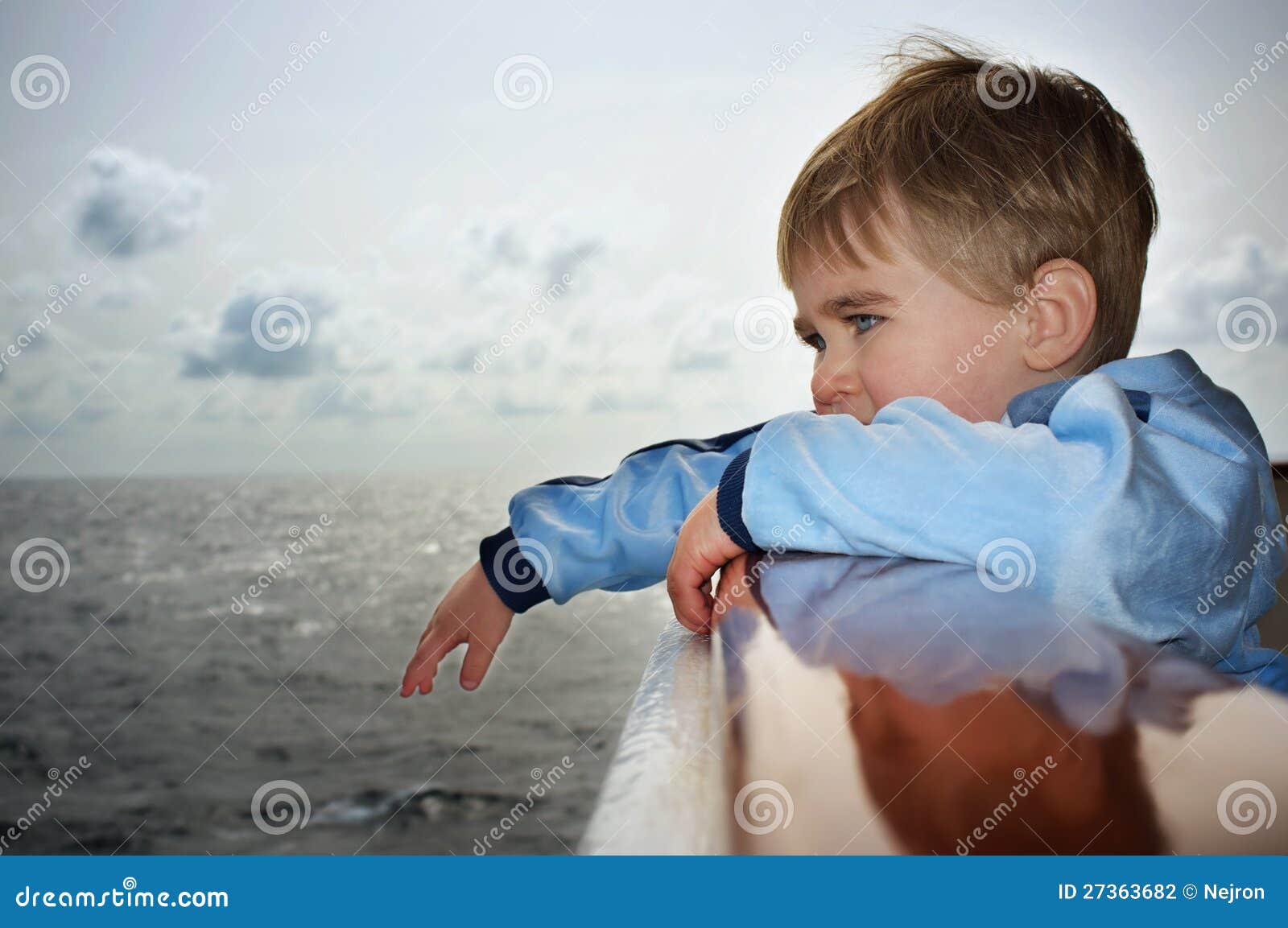 Boy looking at the sea stock photo. Image of closeup - 27363682