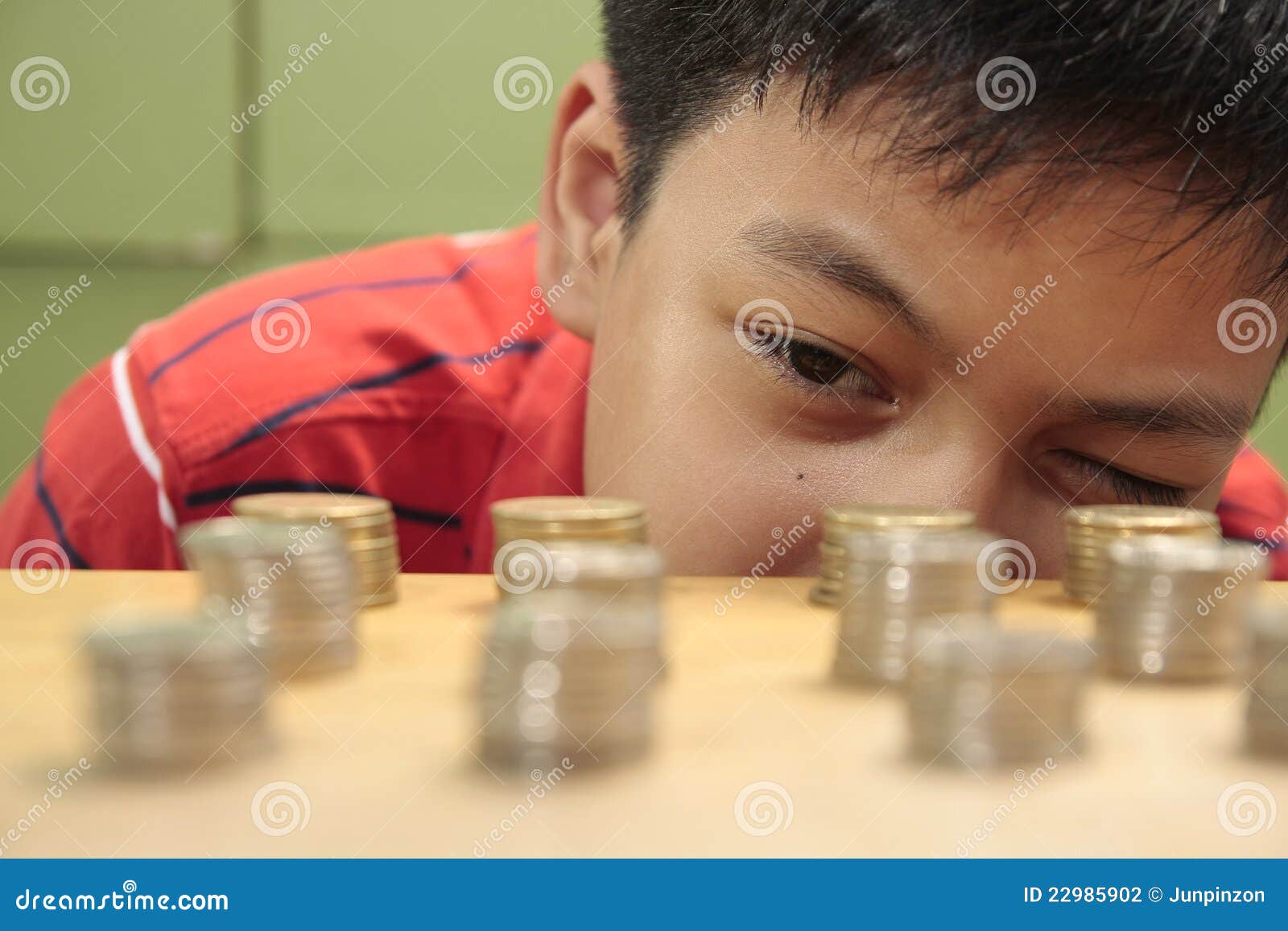 Boy Looking at Stacks of Coins Stock Photo - Image of growth, bill ...
