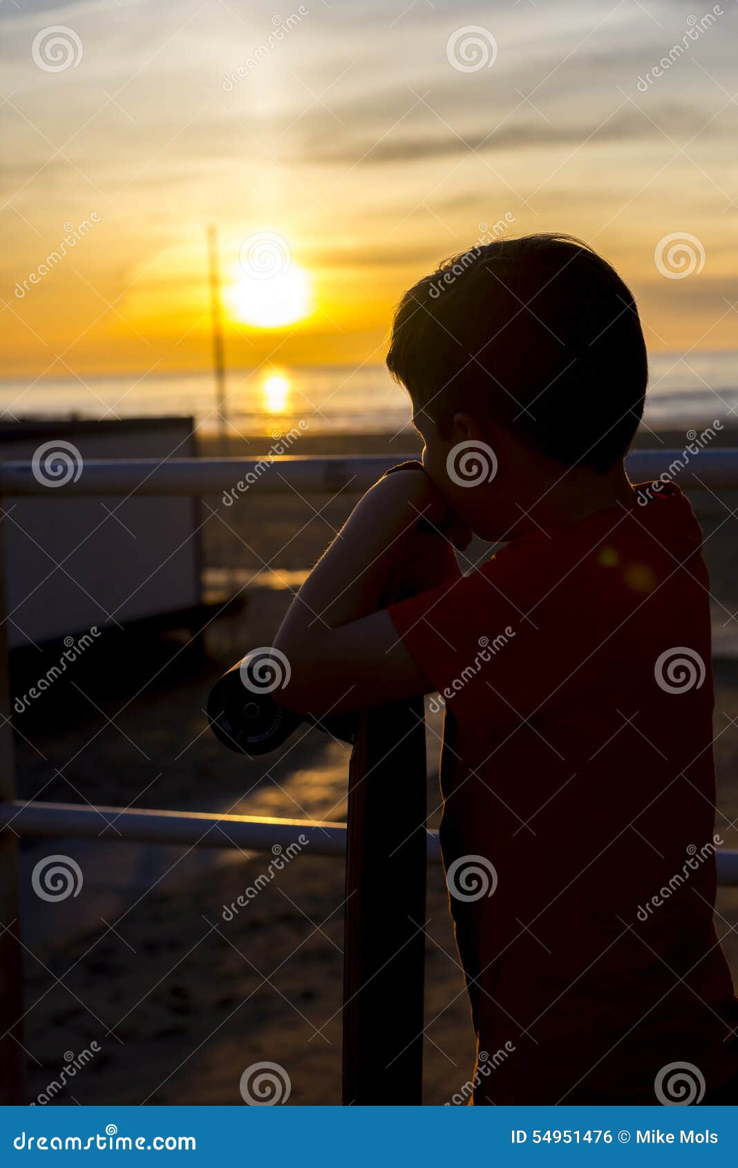 Boy looking at sunset stock photo. Image of vertical - 54951476