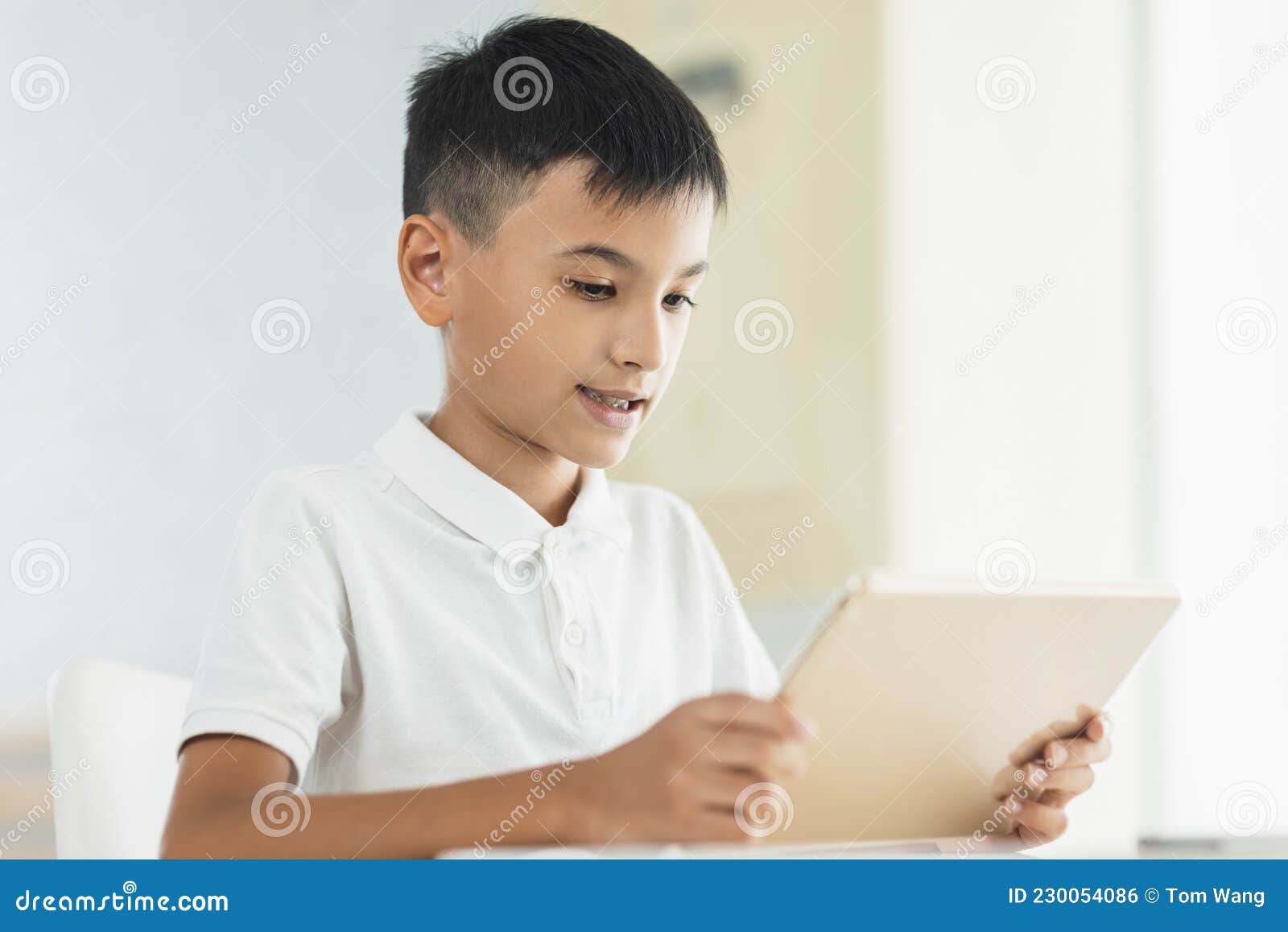 Boy Looking at Tablet.Study Online Stock Photo - Image of school ...