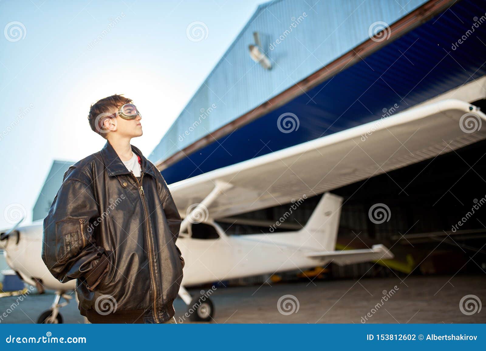 Boy Looking Thoughtfully, Thinking about First Flight, Dressed in Large ...