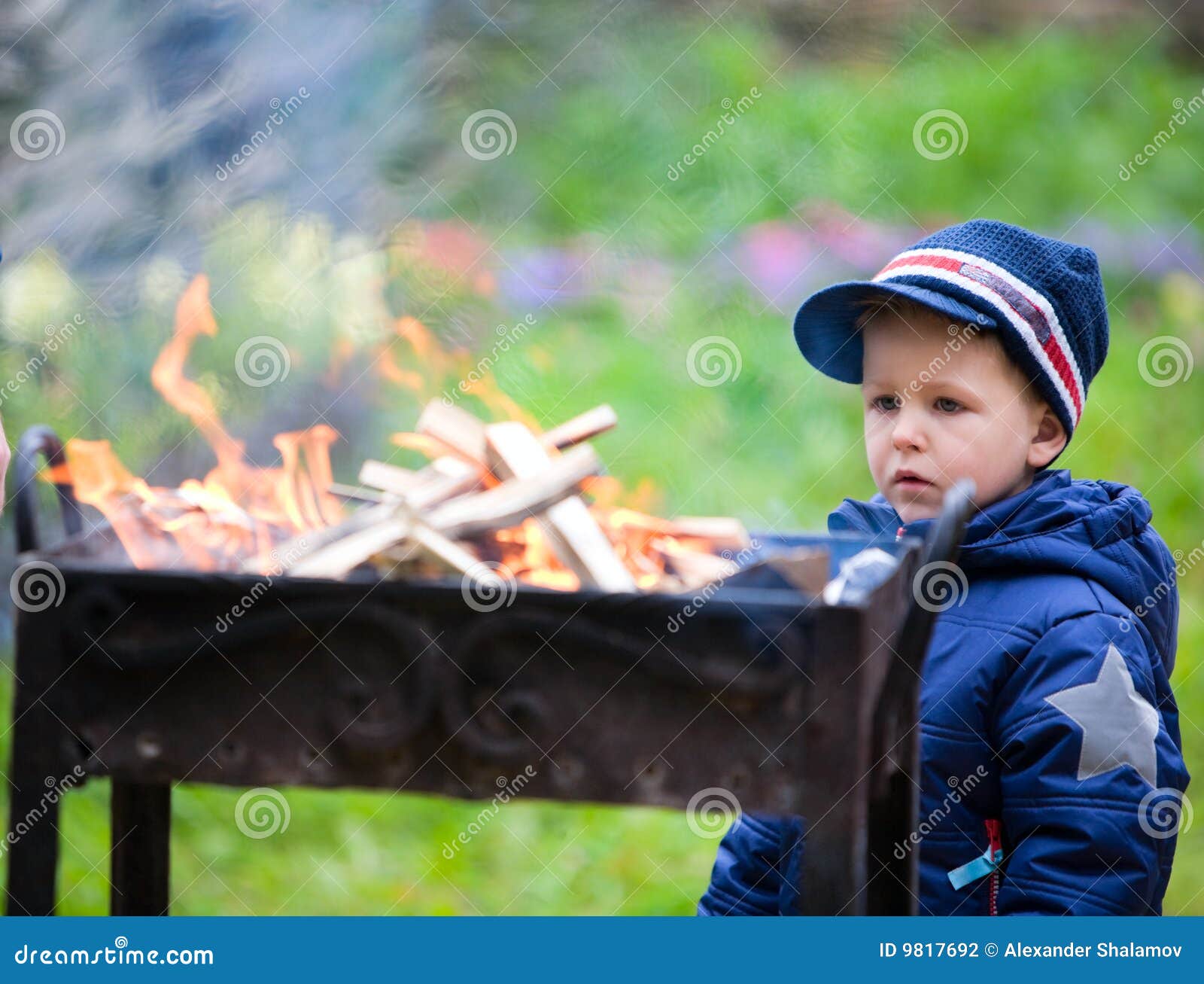 Boy looking to fire stock photo. Image of bonfire, outdoor - 9817692