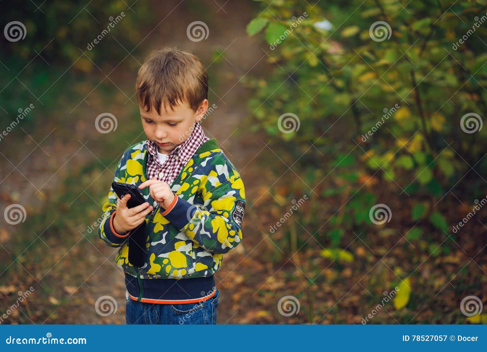 Boy Looking To Smartphone in Your Hand Stock Image - Image of ...