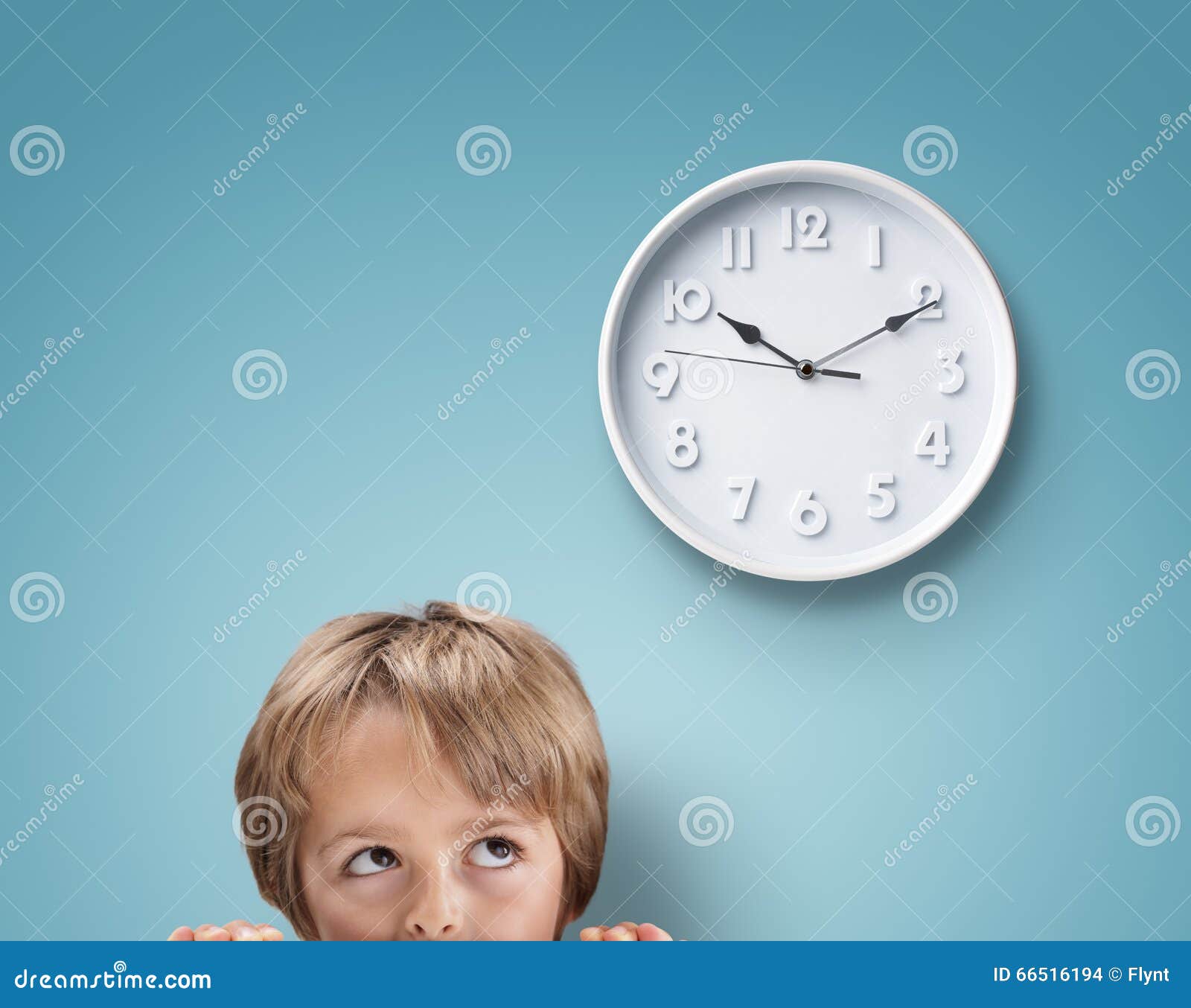 Boy looking up at a clock stock photo. Image of cute - 66516194