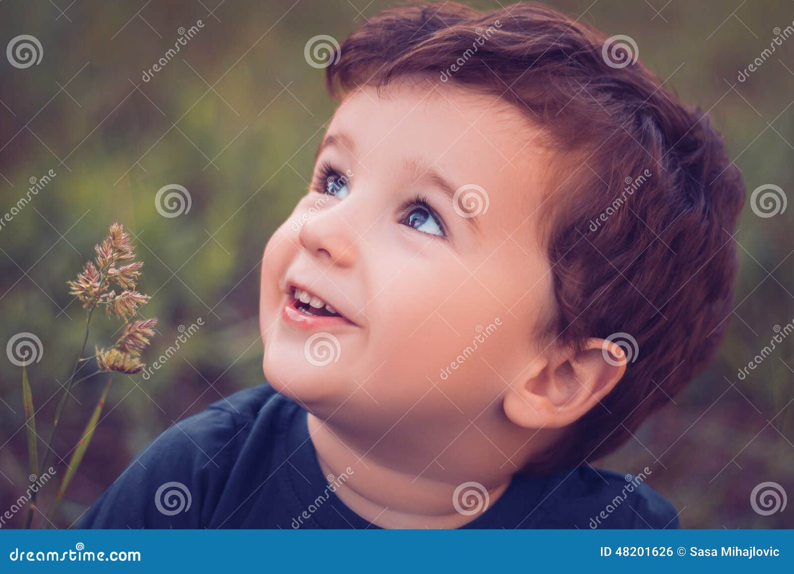 Boy looking up and smiling stock photo. Image of smile - 48201626
