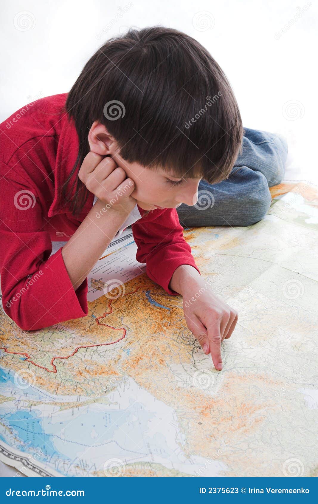 Boy Looks Map Stock Image | CartoonDealer.com #2375623