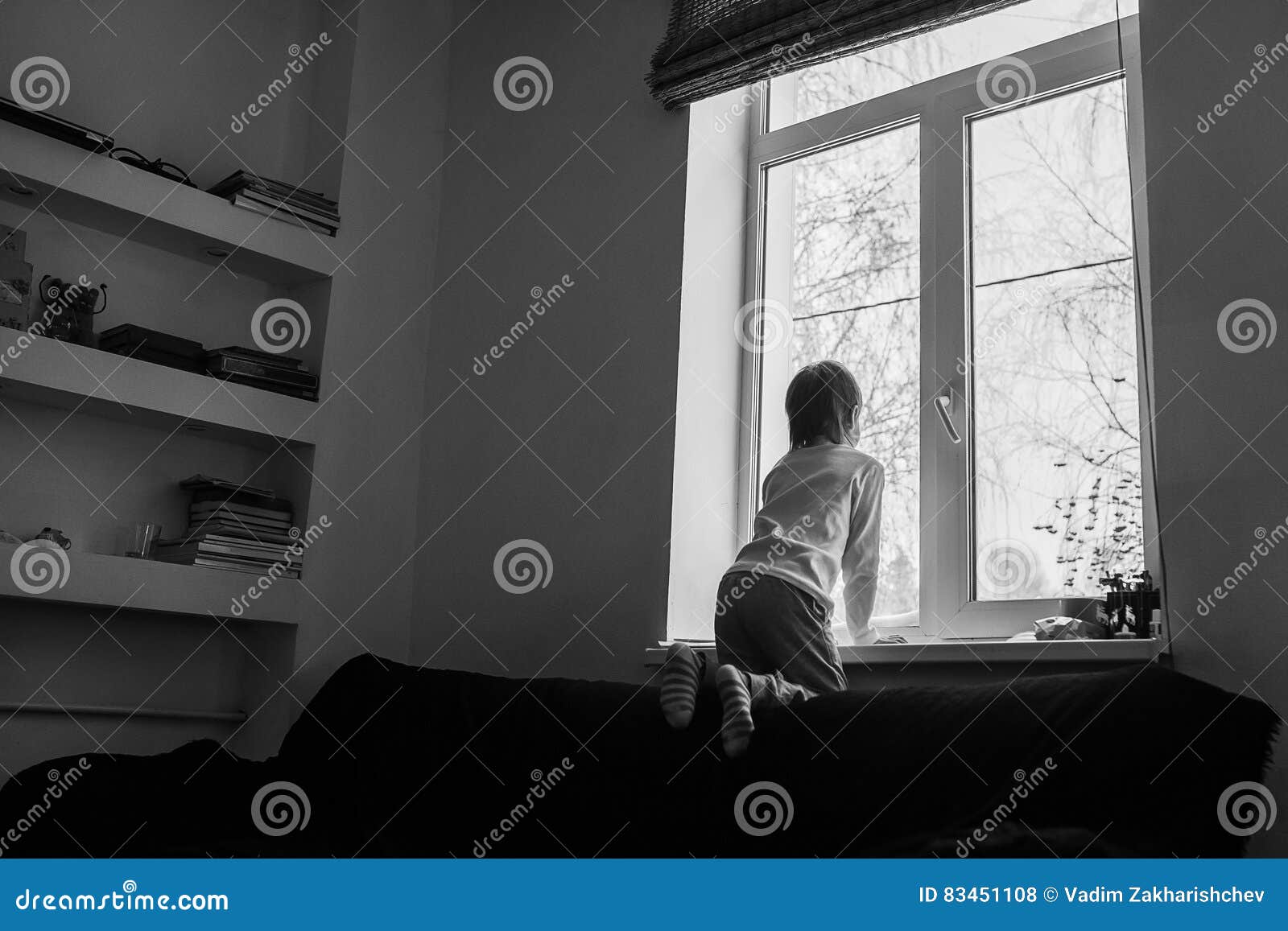 Boy Looks Out the Window on a Winter Day Stock Photo - Image of child ...