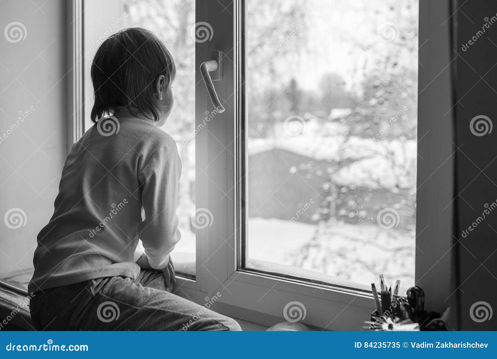 Boy Looks Out the Window on a Winter Day Stock Image - Image of glass ...
