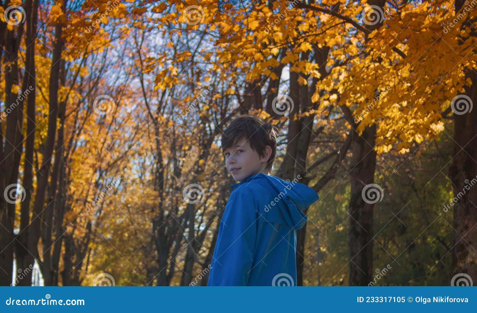The Boy Looks Over His Shoulder and Smiles. Stock Image - Image of ...