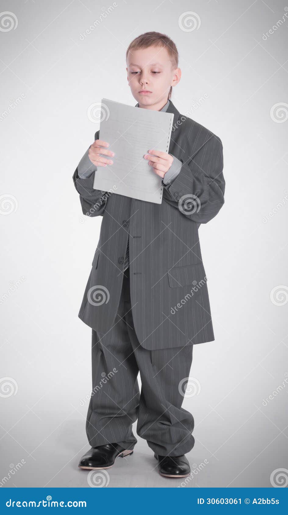 Boy looks on paper stock image. Image of hand, little - 30603061