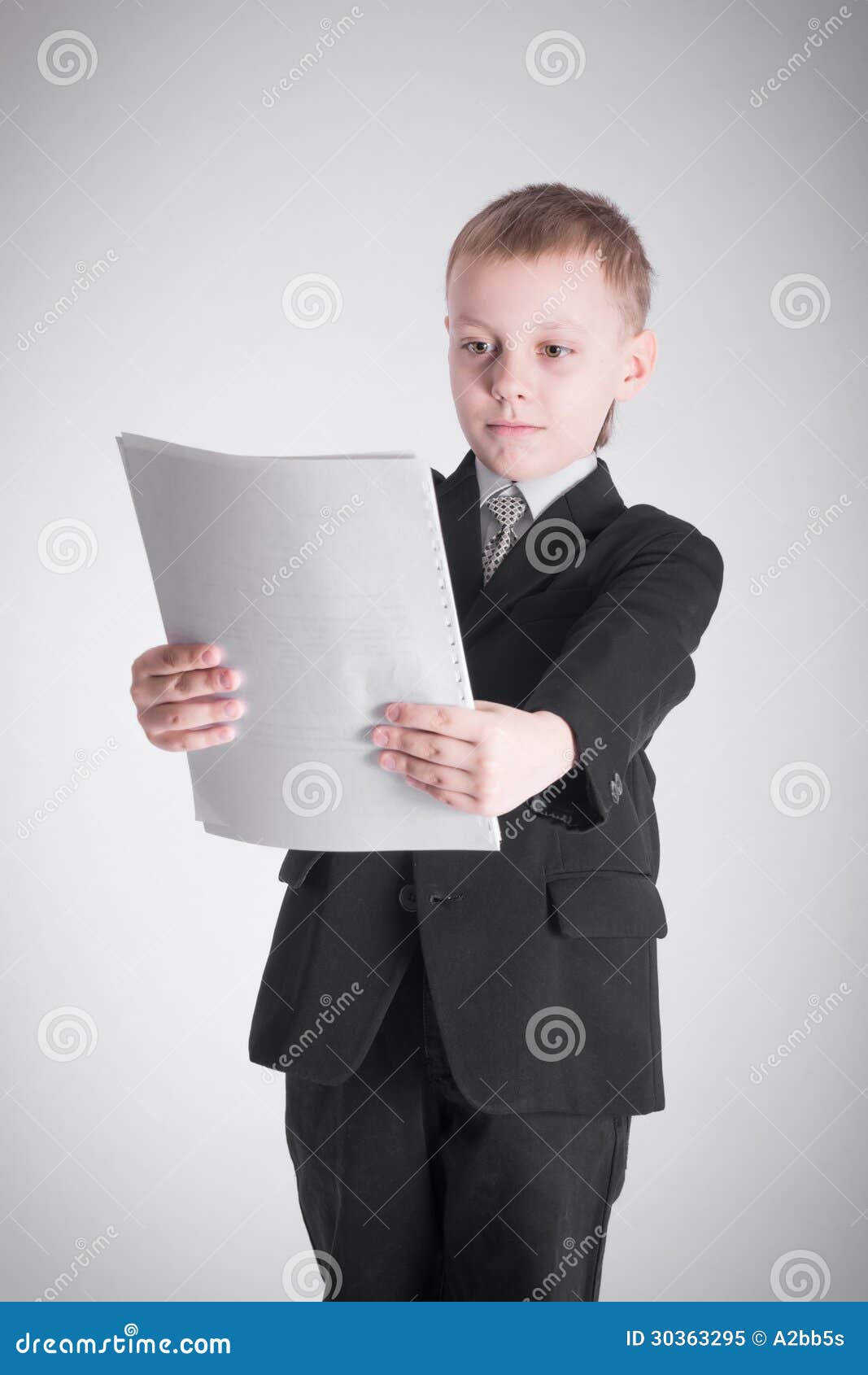 Boy looks on paper stock image. Image of learn, human - 30363295
