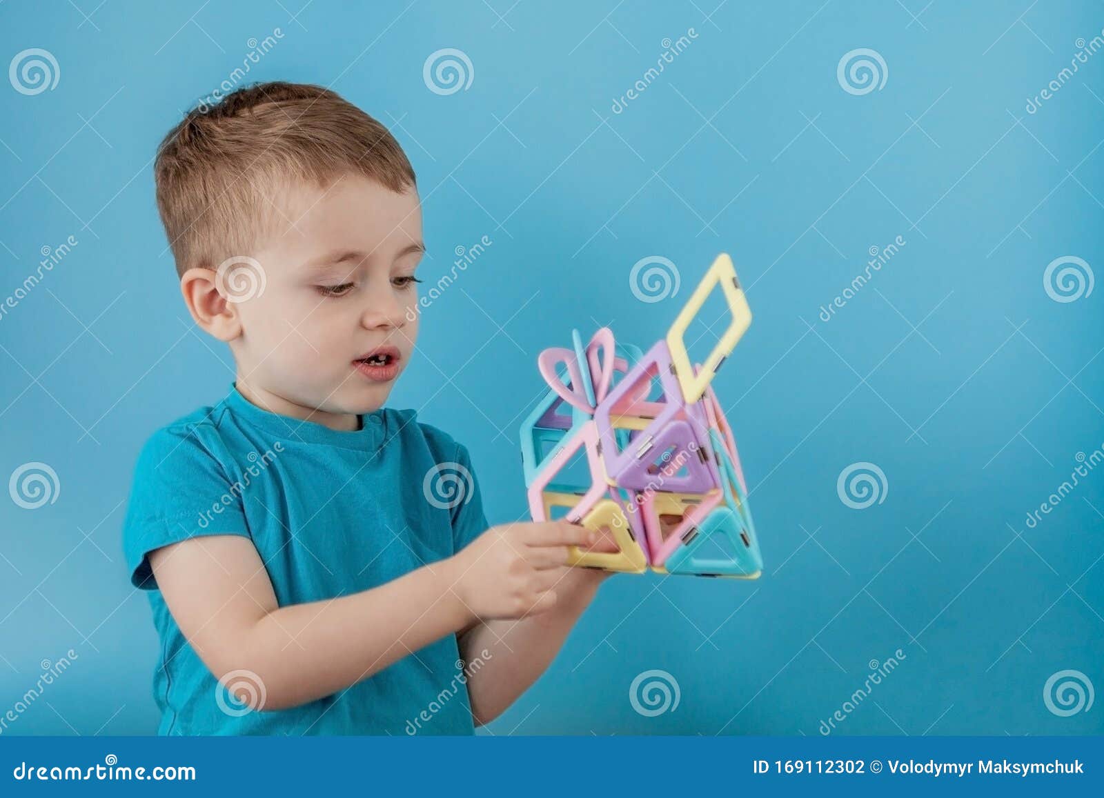 Boy Looks through the Shape in the Color Constructor with the ...