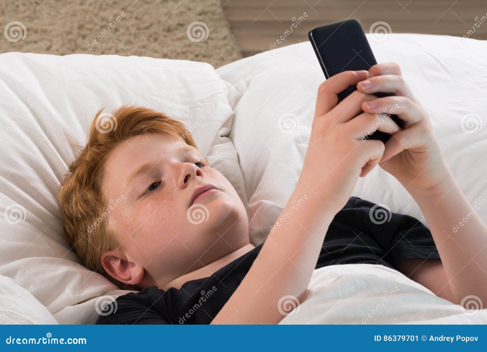 Boy Holding Mobile Phone stock image. Image of leisure - 86379701 Boy Holding Mobile Phone stock image. Image of leisure - 86379701