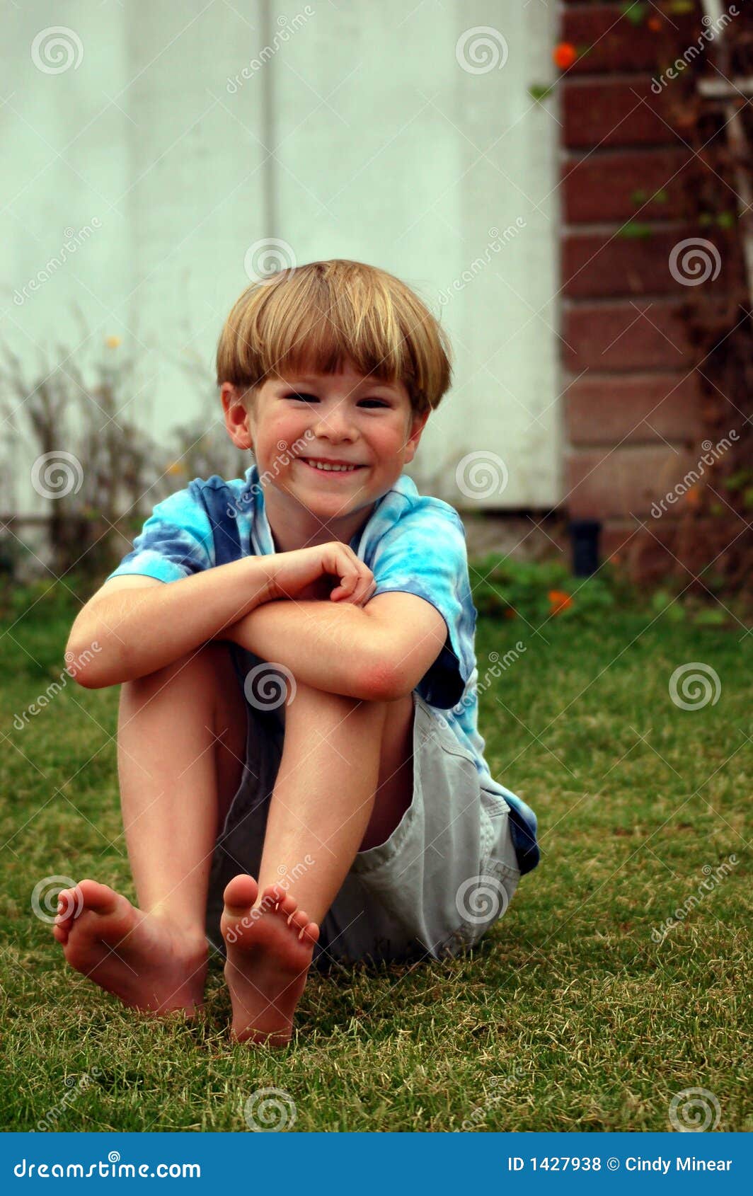 Boy lying down in grass stock photo. Image of grass, cheerful - 1427938