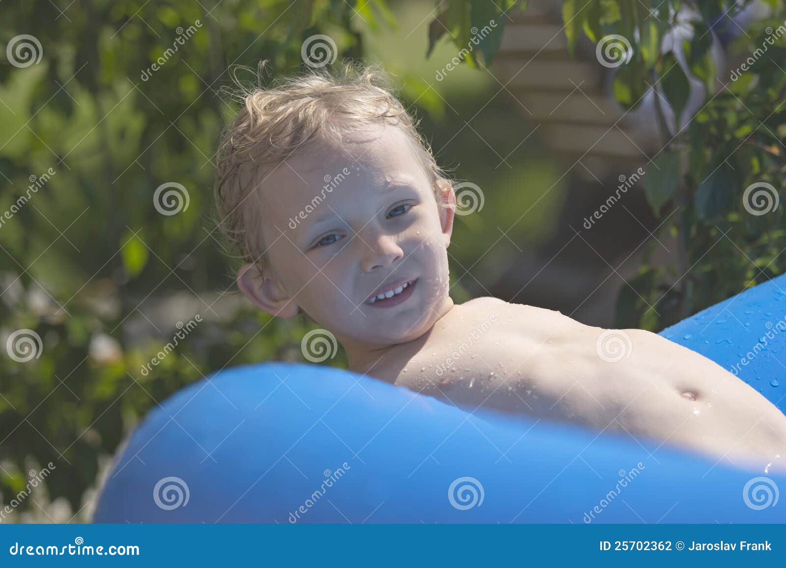 Boy Lying on the Edge of the Inflatable Pool. Stock Photo - Image of ...
